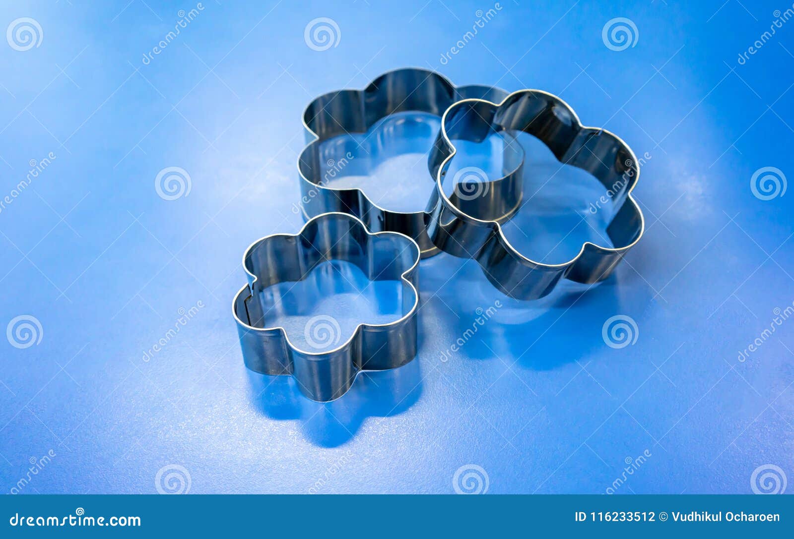 Group of Cookie Cutters Isolated on Blue Stock Photo - Image of cookies ...