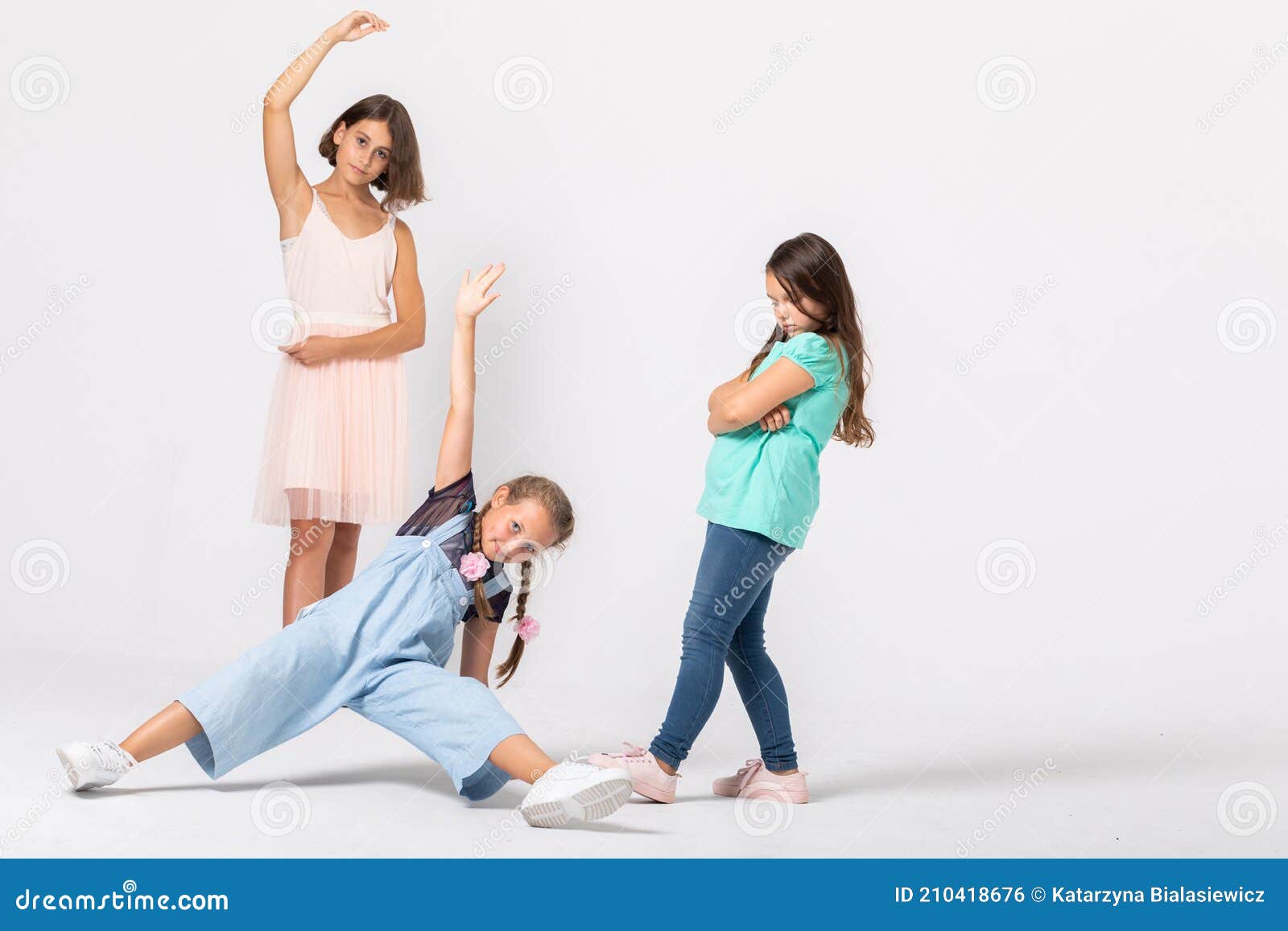 Cool Girls Fooling Around in White Room, Making Funny Poses Stock Photo ... Cool Girls Fooling Around in White Room, Making Funny Poses Stock Photo ...