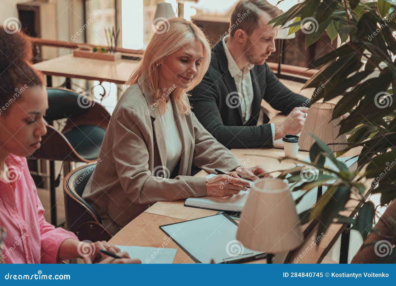 Group of Coworkers Working Together and Talking at Modern Office ...