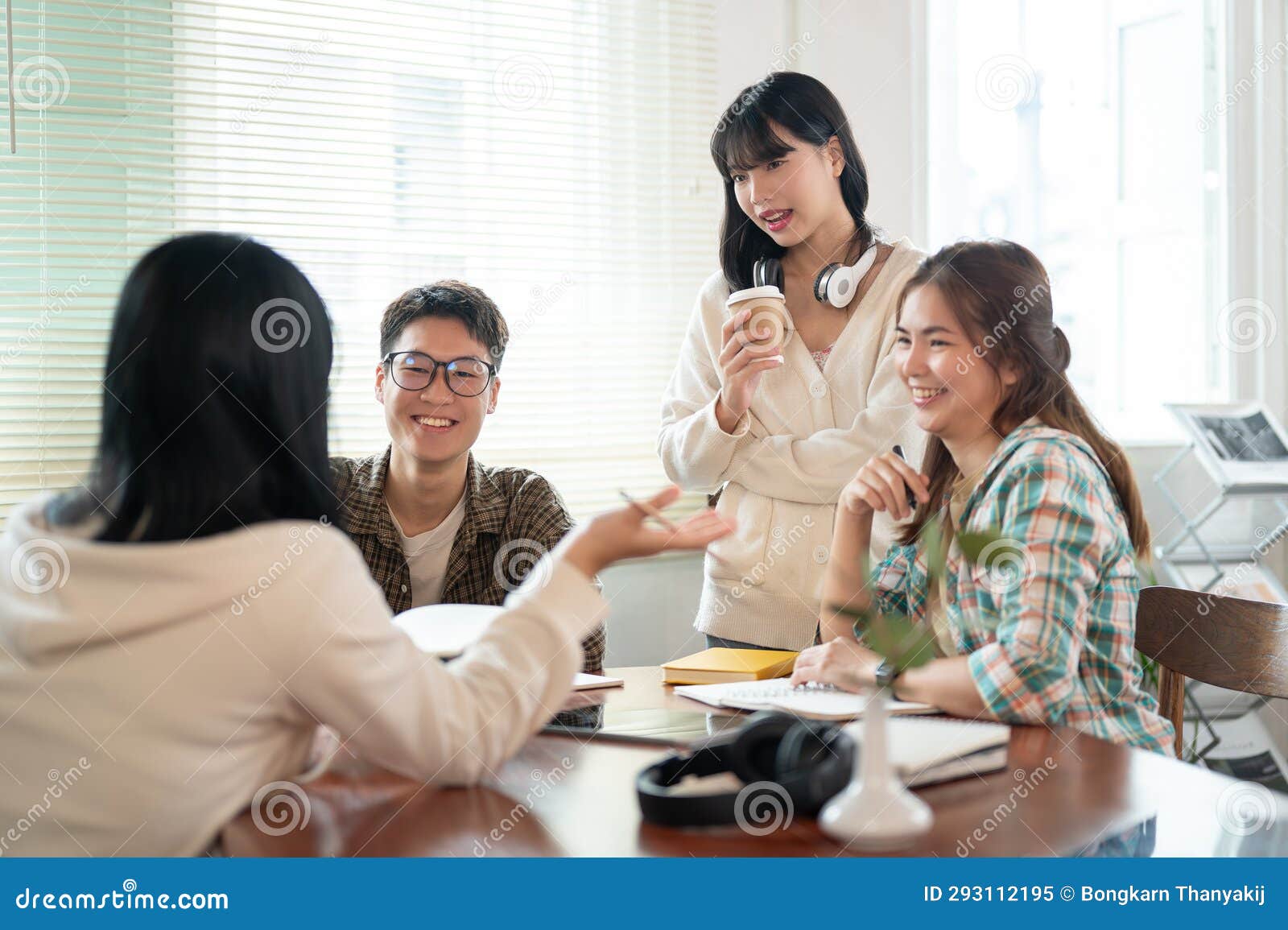 A Group of Creative and Smart Young Asian Students are Discussing Work ...