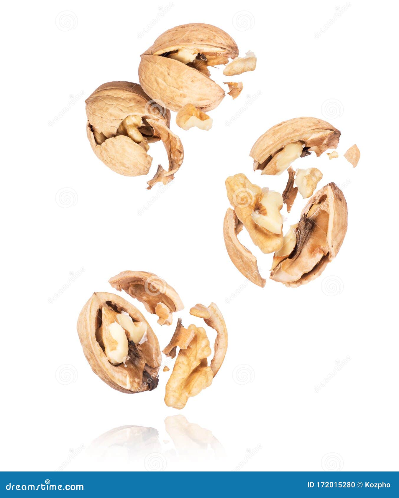 Group of Crushed Walnuts in the Air Close-up on a White Background ...