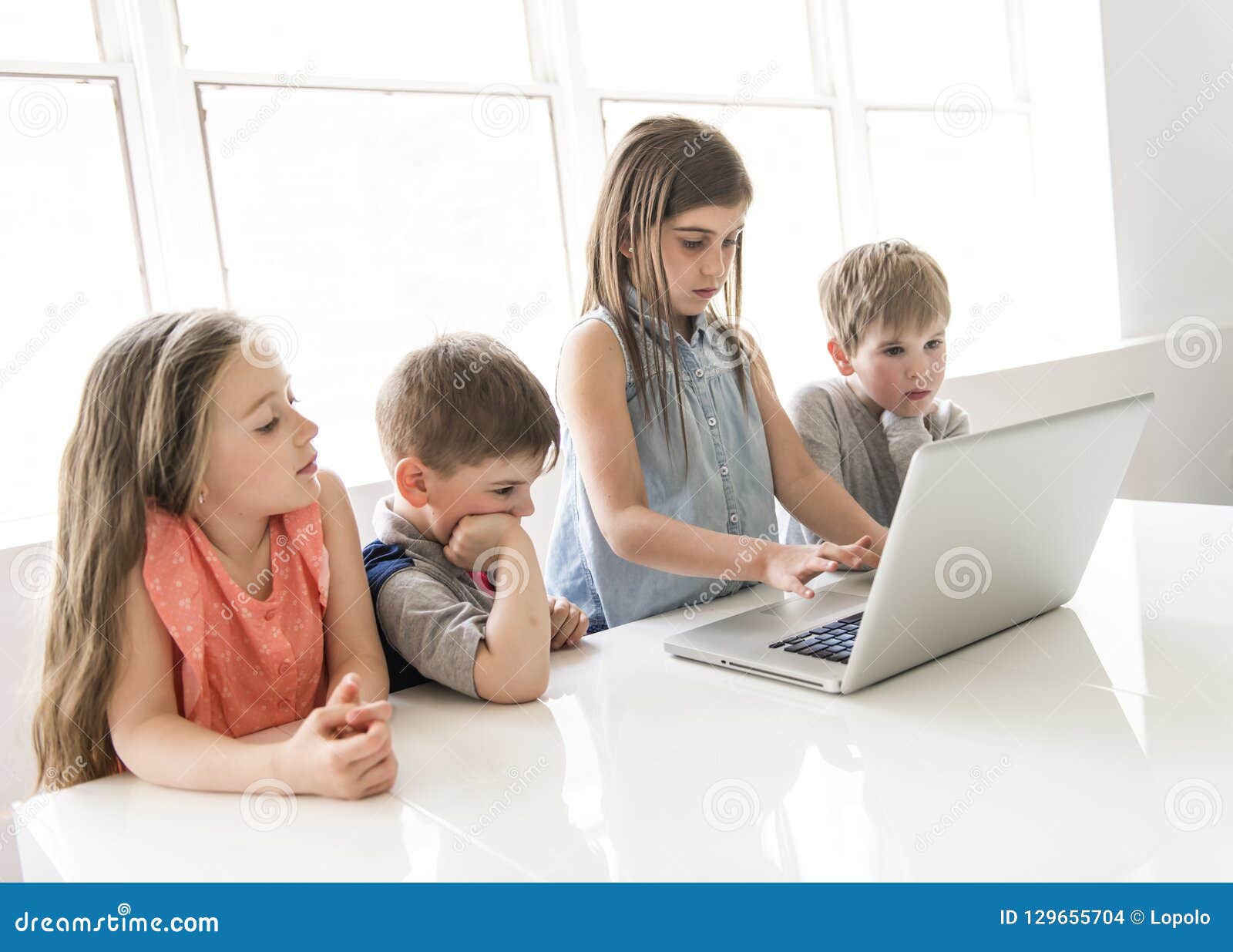 Group of Curious Children Watching Stuff on the Laptop Screen Stock ...