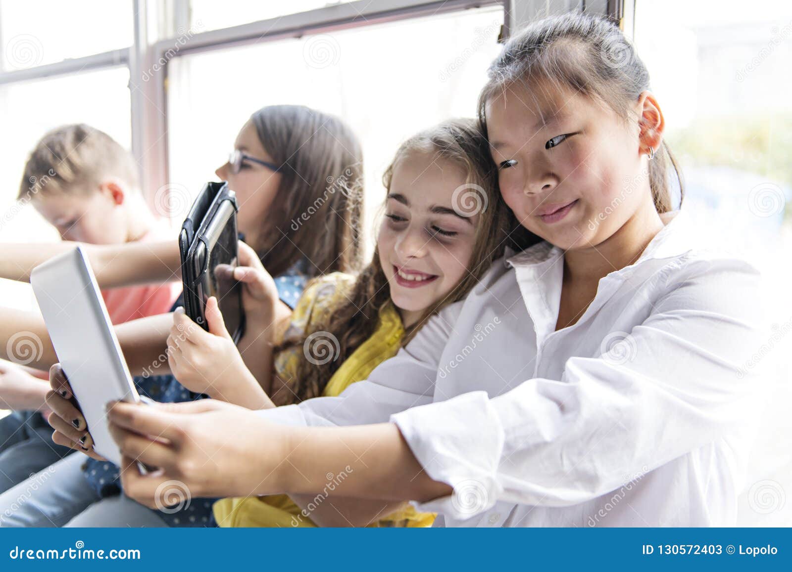 Group of Curious Children Watching Stuff on the Tablet Screen Stock ...