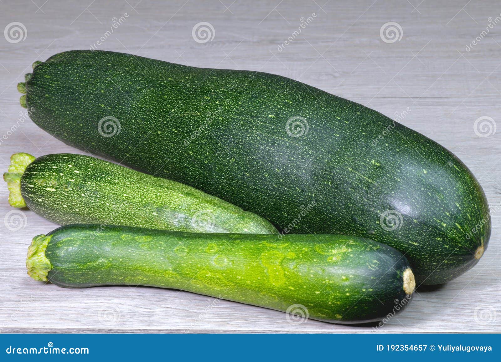 A Group of Cut Fresh Zucchini in the Skin on a Light Table Stock Image ...