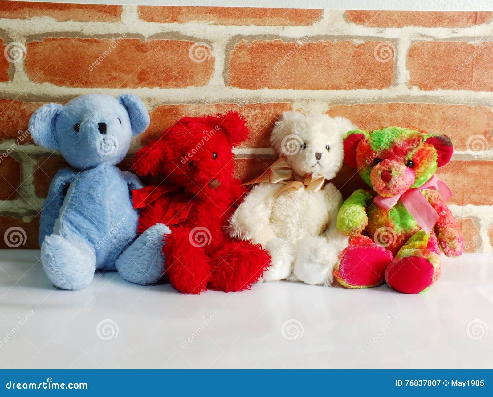 A Group of Cute Teddy Bears Sitting Together Against with Wallpaper ...