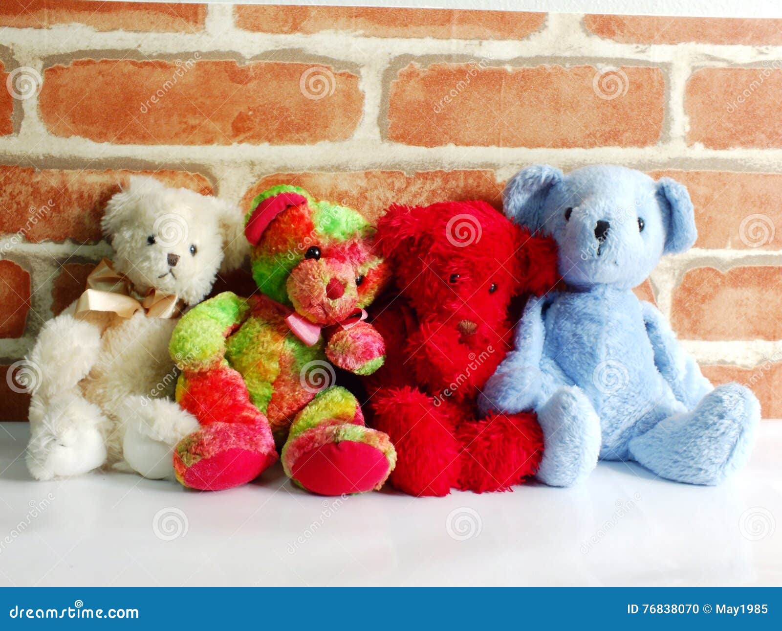 A Group of Cute Teddy Bears Sitting Together Against with Wallpaper ...