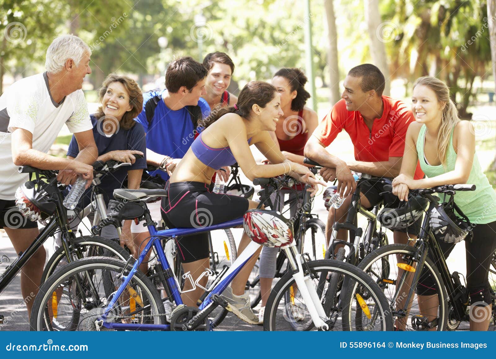 Group of Cyclists Resting during Cycle Ride through Park Stock Photo ...