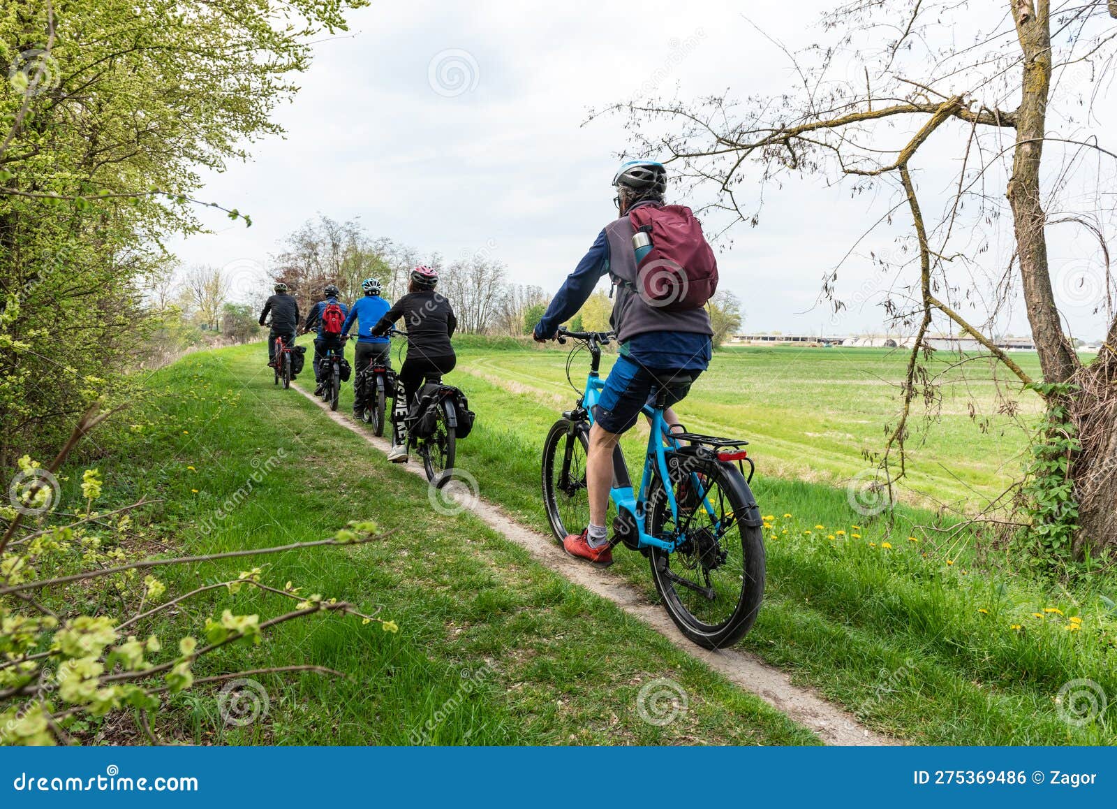 A group of cyclists riding editorial photo. Image of bike - 275369486