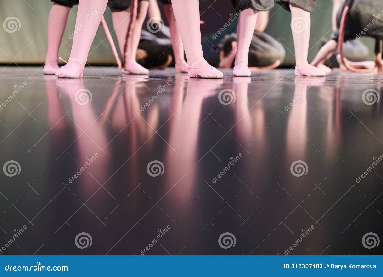 A Group of Dancers in Different Poses are Standing on the Stage ...