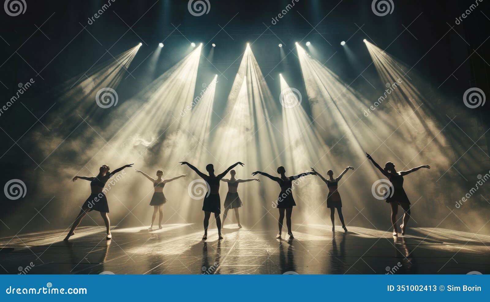 A Group of Dancers Performing a Synchronized Routine on a Stage Stock ...