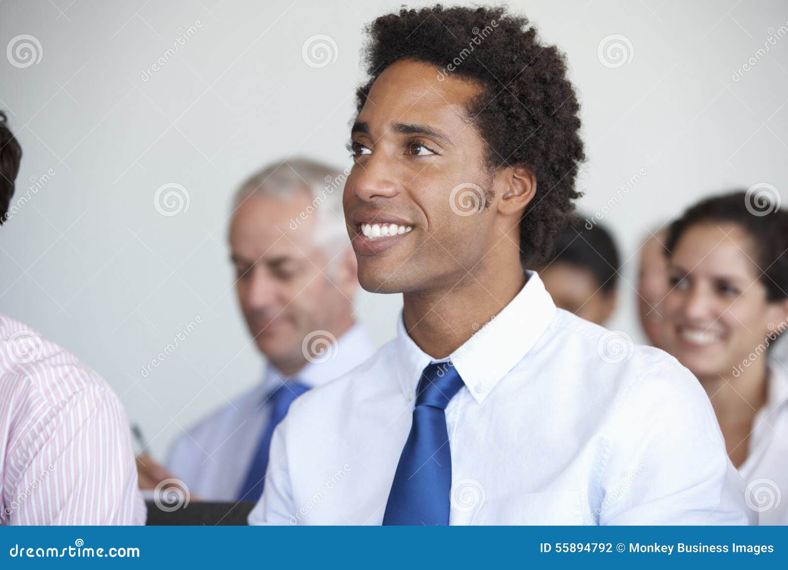 Group of Delegates Listening To Presentation at Conference Stock Photo ...