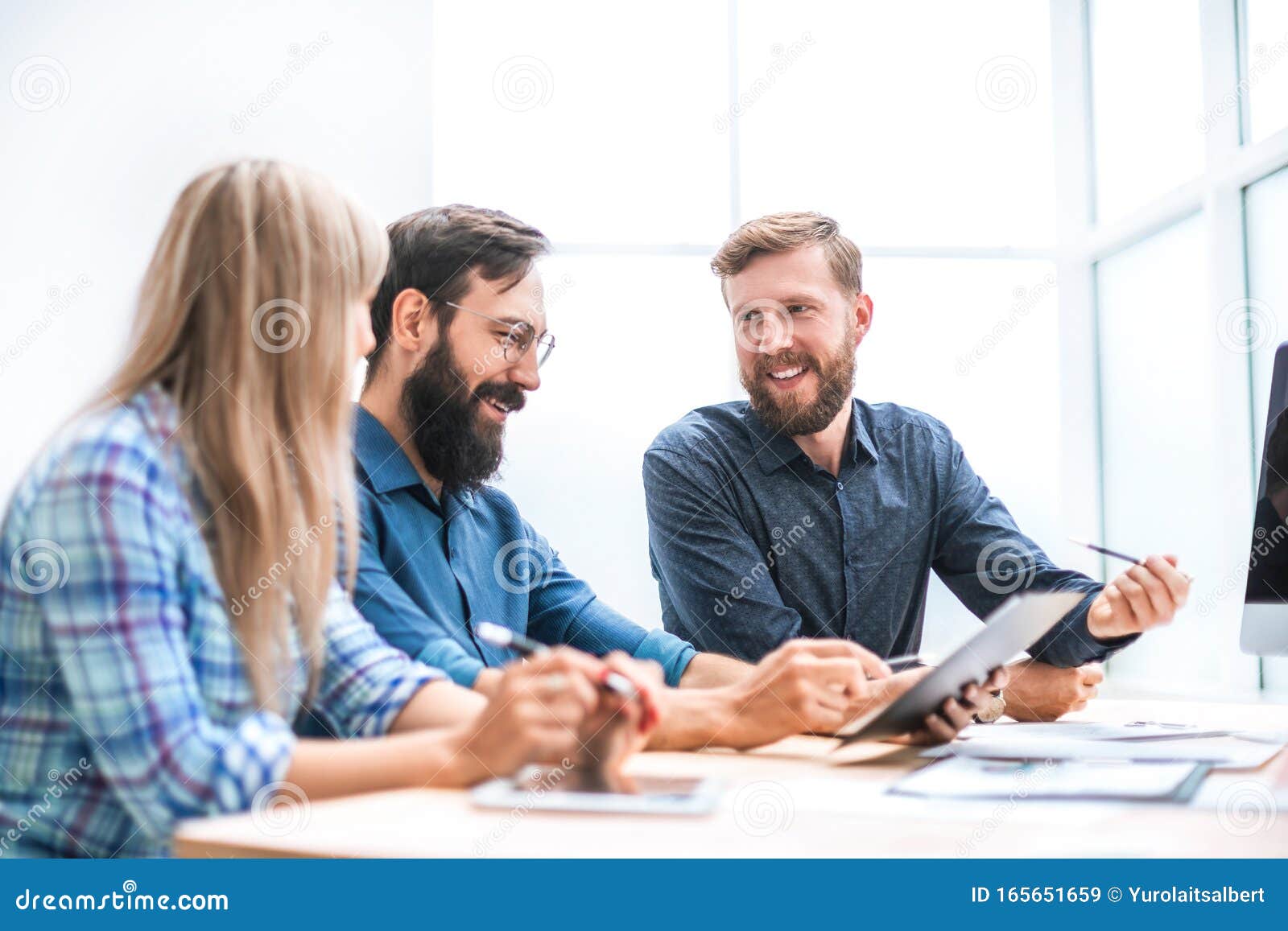 Group of Designers Discussing a New Project. Stock Image - Image of ...