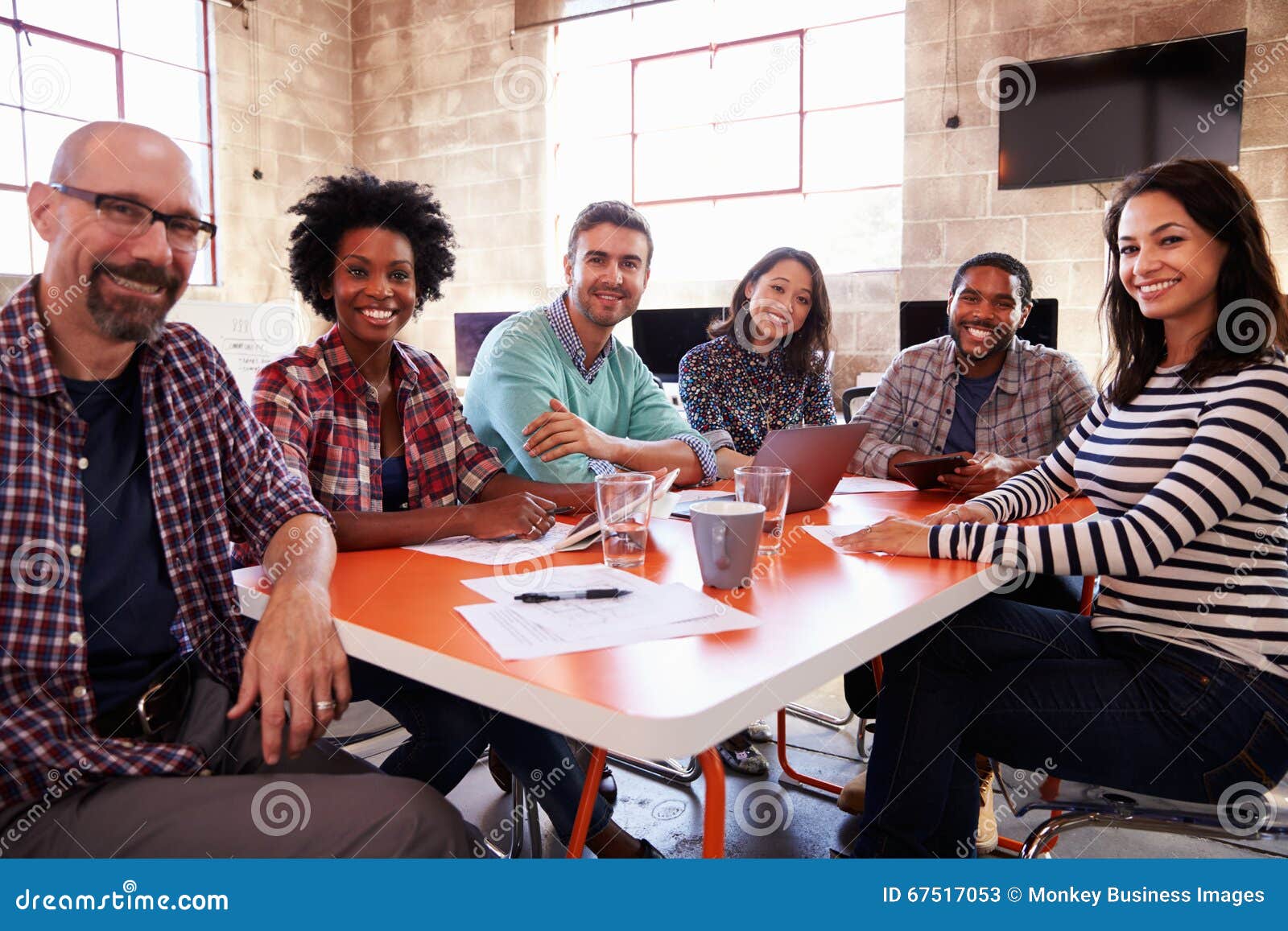 Group of Designers Having Meeting Around Table in Office Stock Image ...