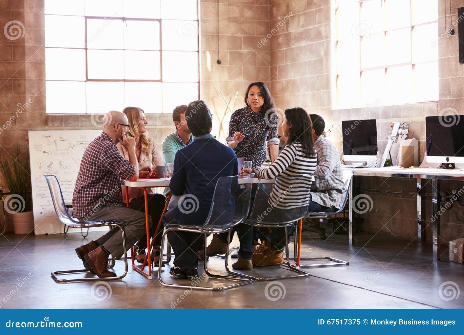 Group of Designers Having Meeting Around Table in Office Stock Image ...