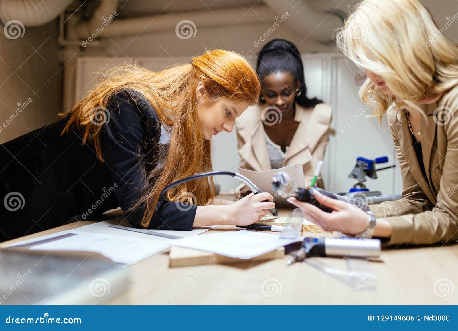 Group of Designers Working on a Project Stock Photo - Image of office ...