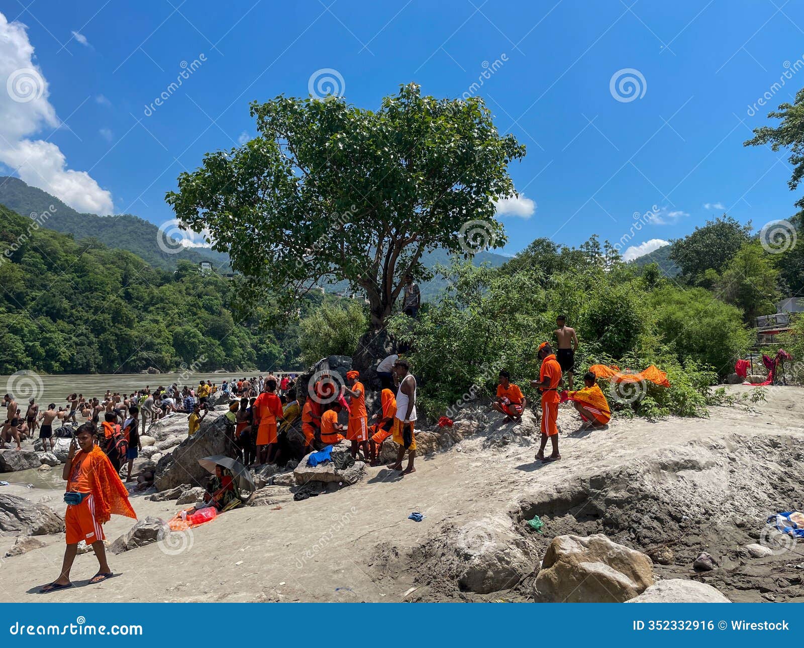 Group of Devotees Taking a Ritual Bath in the Holy River Ganges in ...