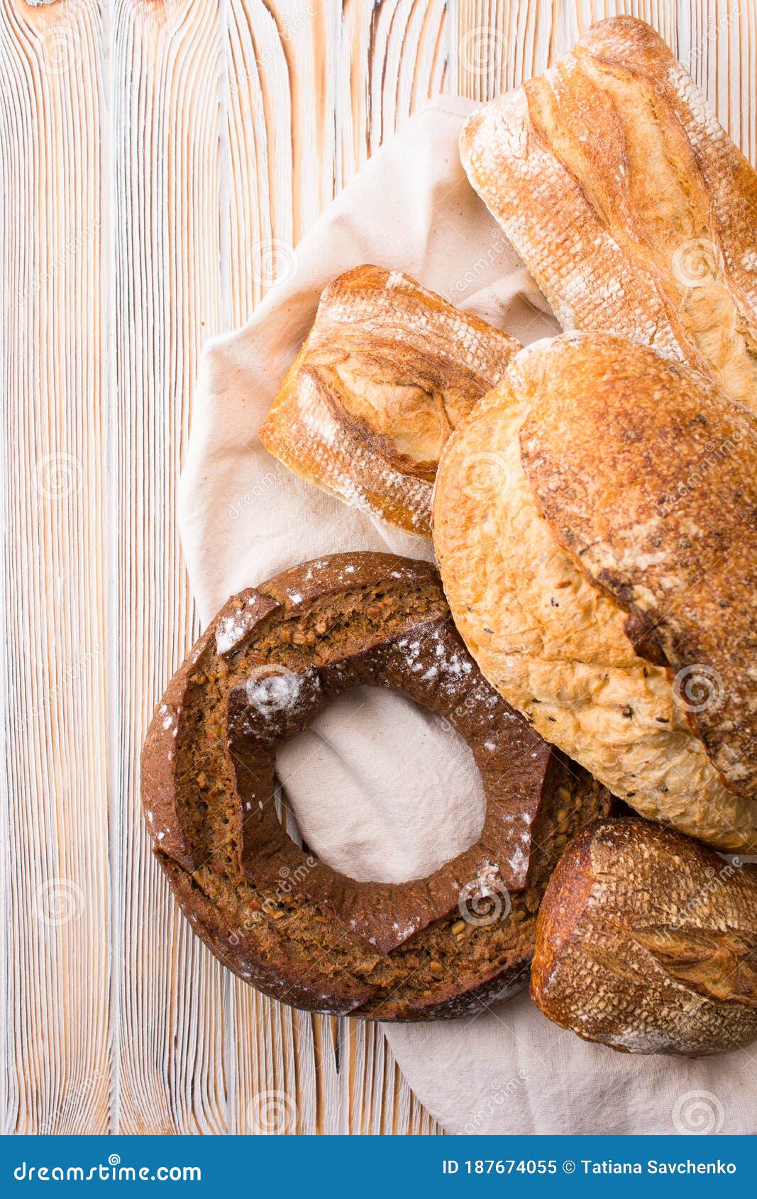 Group of Different Breads on a Light Wooden Background. Vertical Banner ...