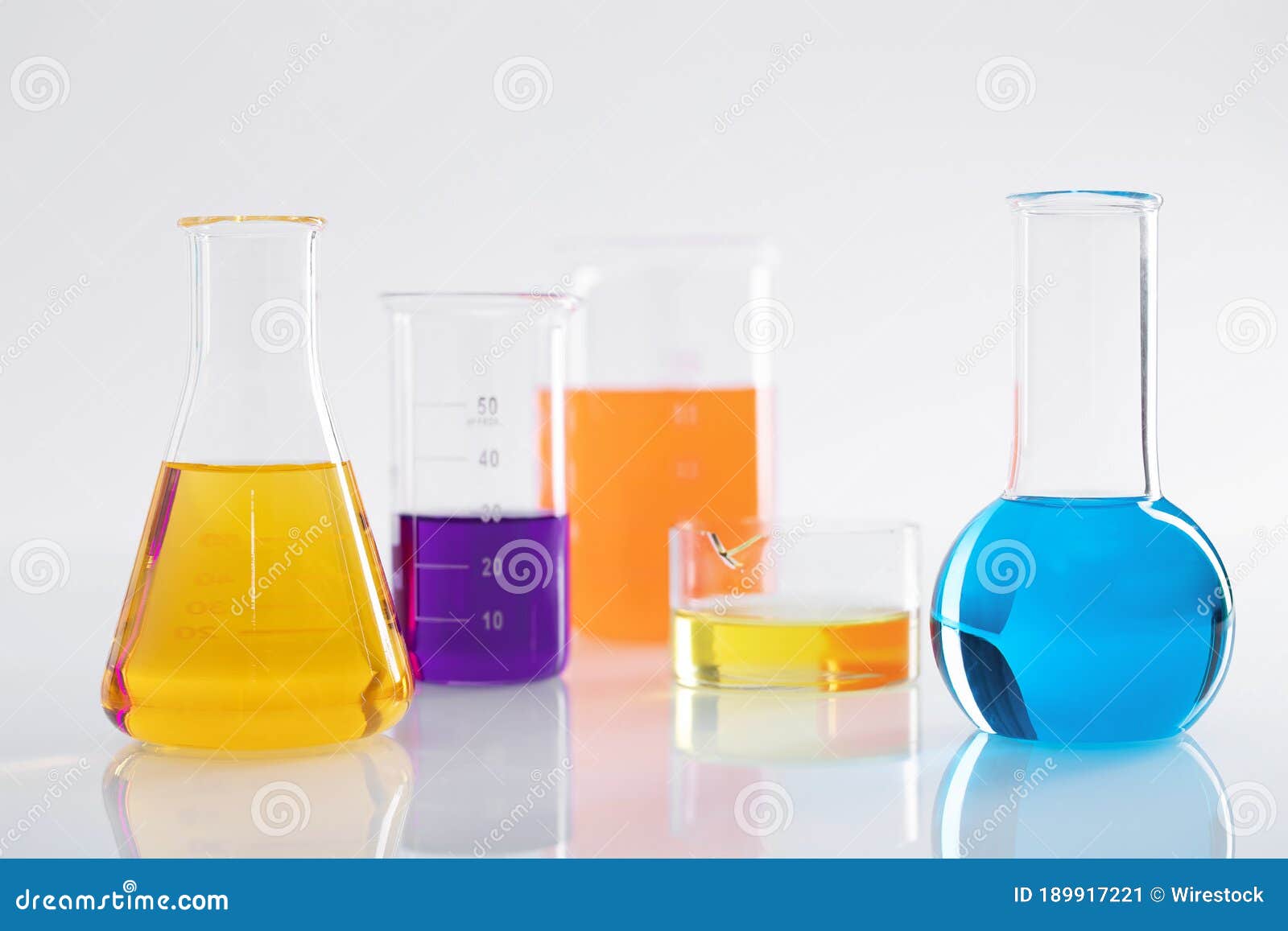 Group of Different Flasks with Colorful Liquids on a White Background ...