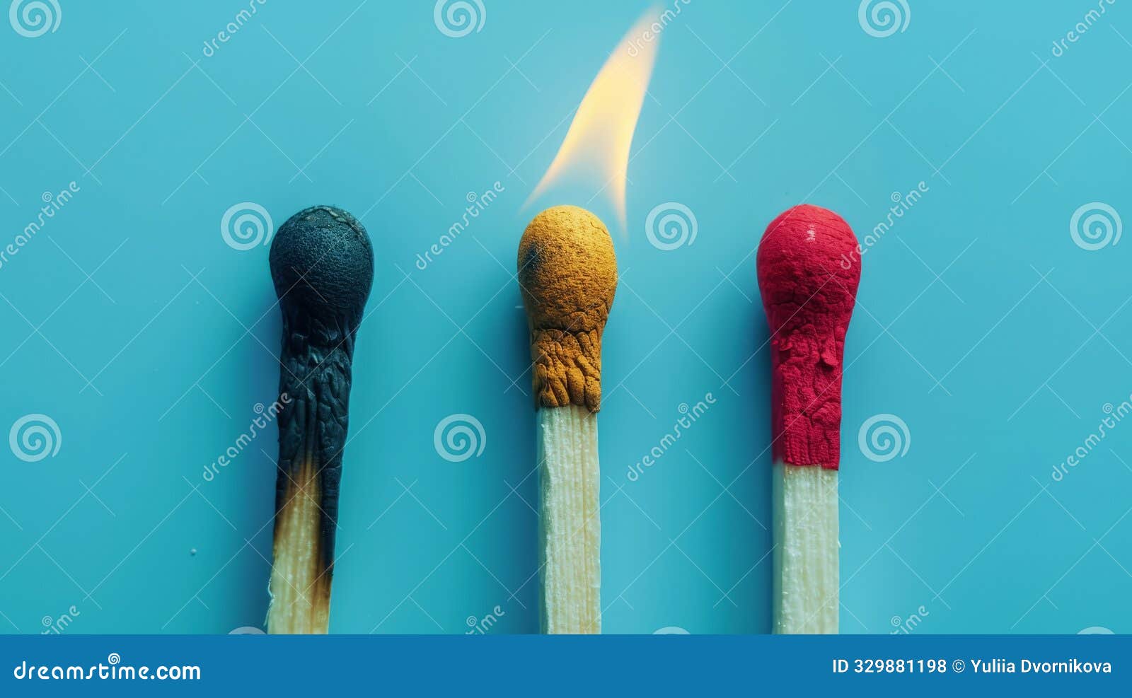 Group of Different Matches, Some Burning, Pastel Blue Background ...