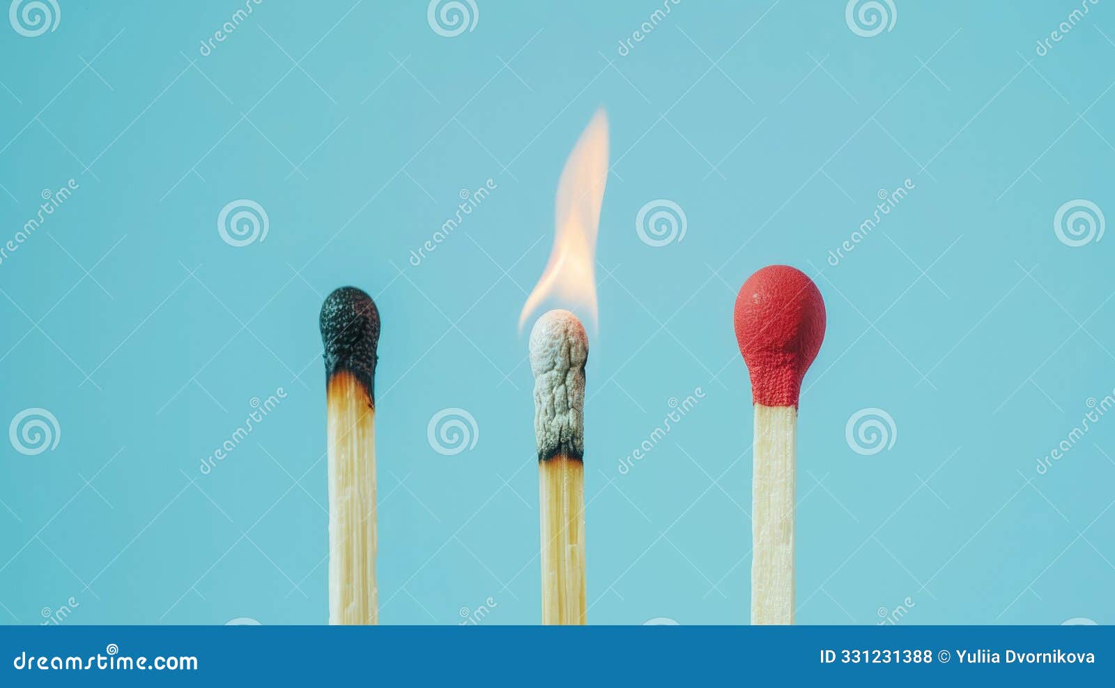 Group of Different Matches, Some Burning, Pastel Blue Background ...