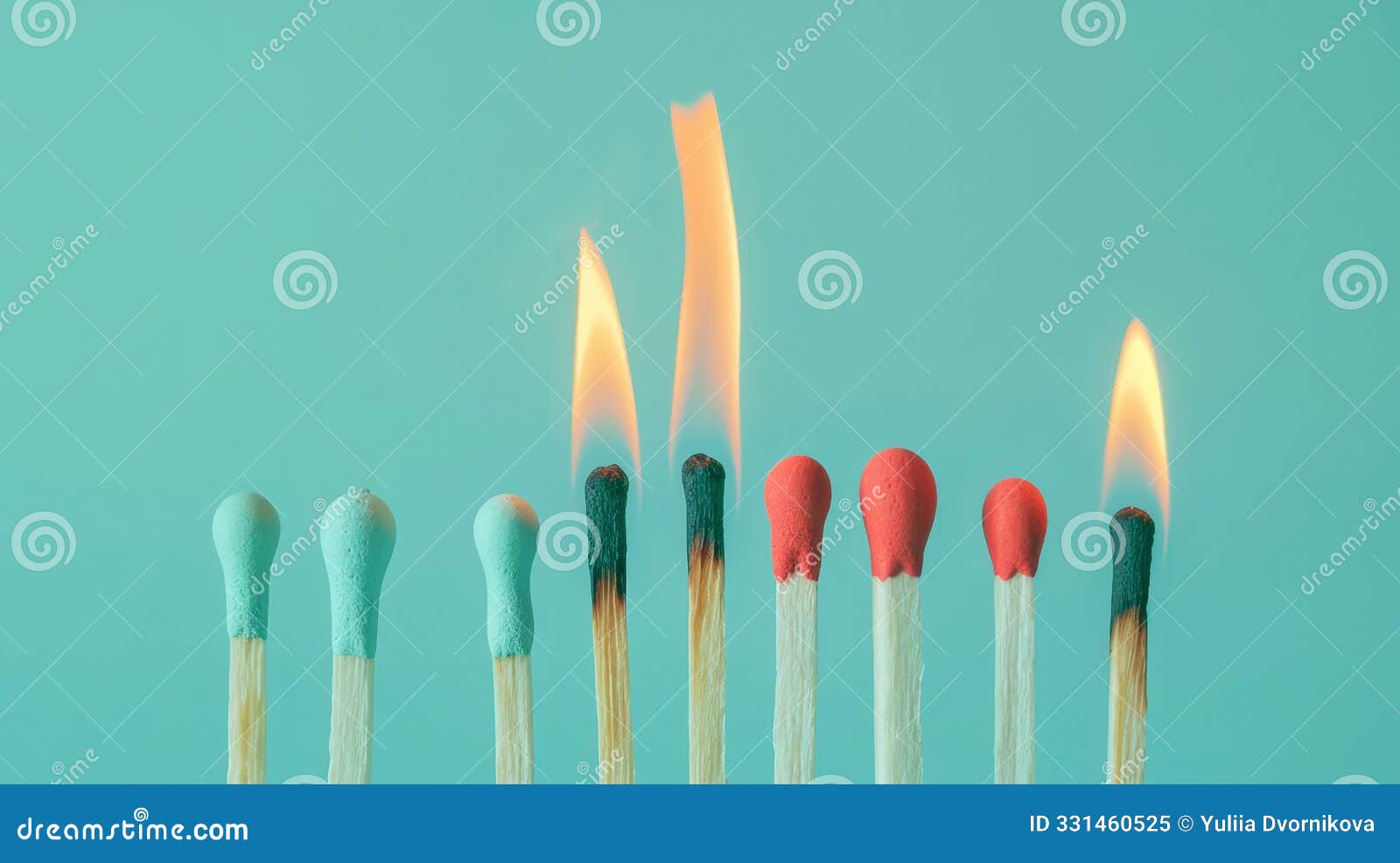 Group of Different Matches, Some Burning, Pastel Blue Background ...