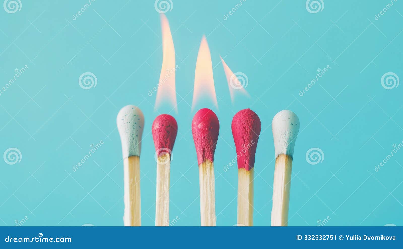 Group of Different Matches, Some Burning, Pastel Blue Background ...