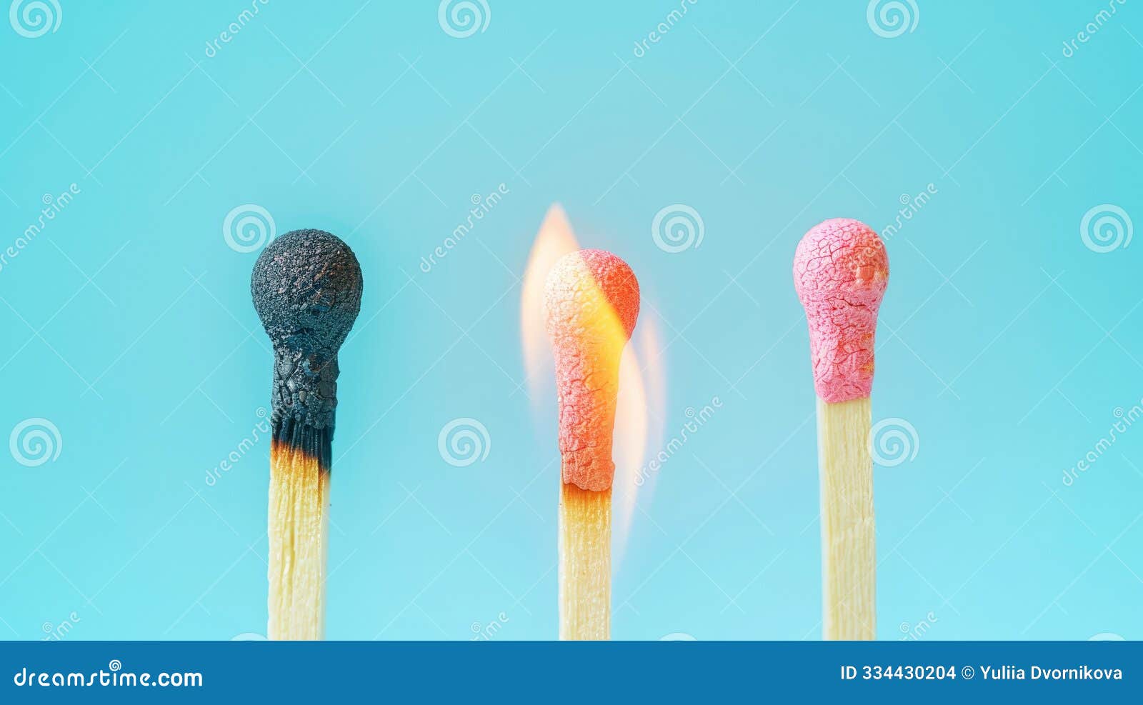 Group of Different Matches, Some Burning, Pastel Blue Background ...