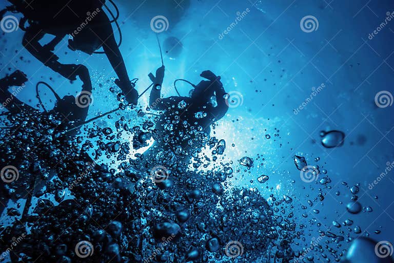 Group of Divers on Safety Stop Underwater Bubbles Stock Photo - Image ...