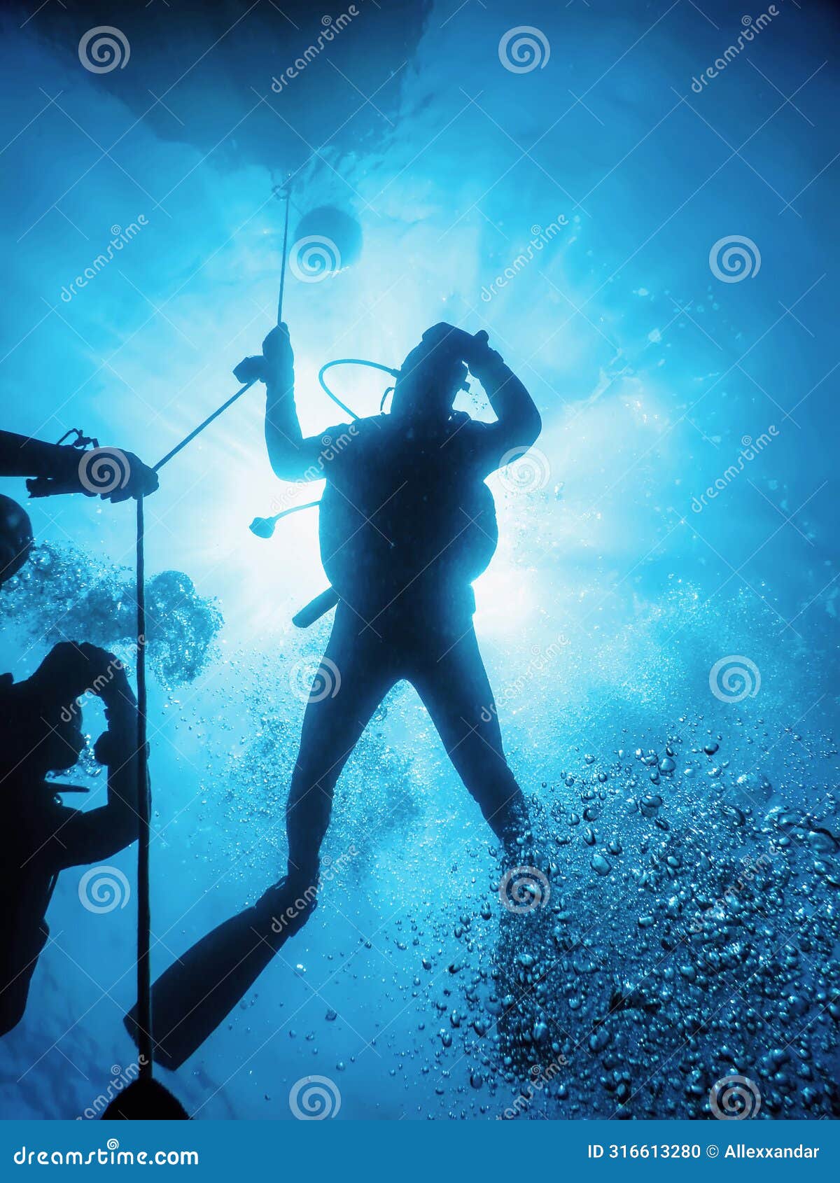 Group of Divers on Safety Stop Underwater Bubbles Stock Photo - Image ...