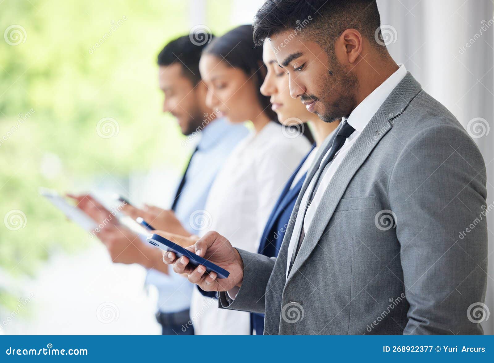 Group of Diverse Businesspeople Waiting for Interview and Using ...