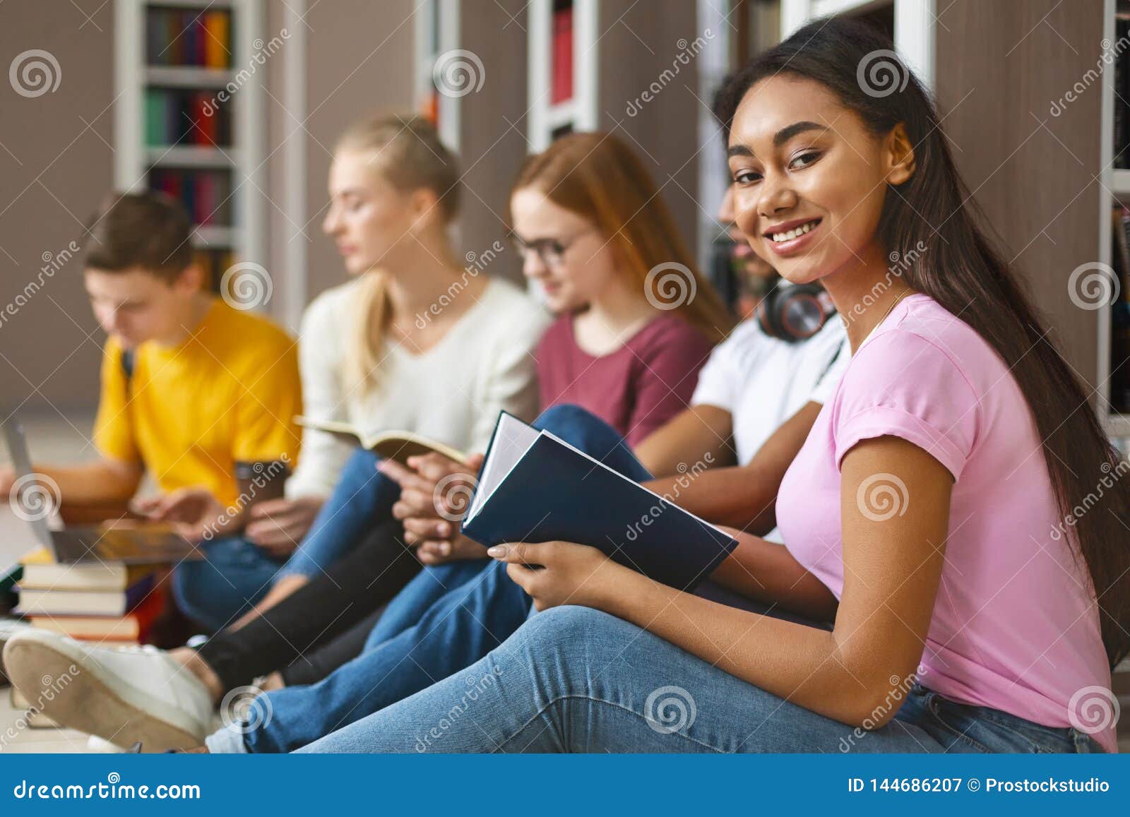 Group of Diverse Classmates Sitting on Floor at Library Stock Image ...
