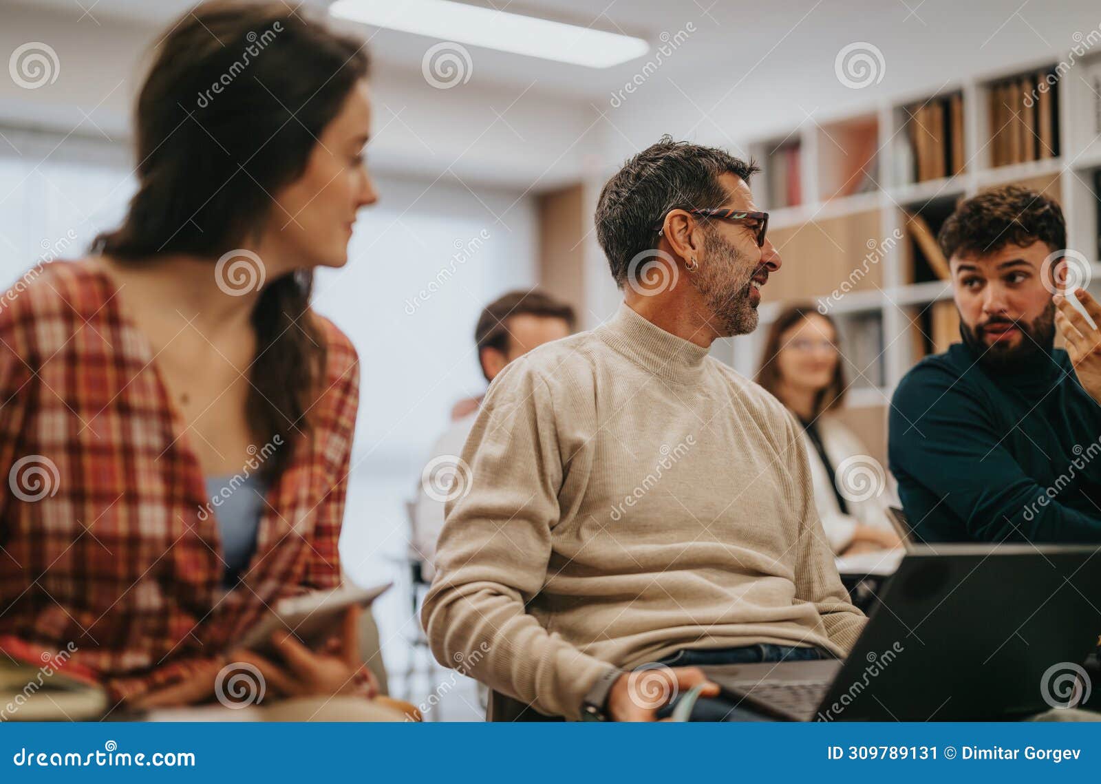 Group of Diverse Colleagues Engaged in a Lively Discussion Over a ...