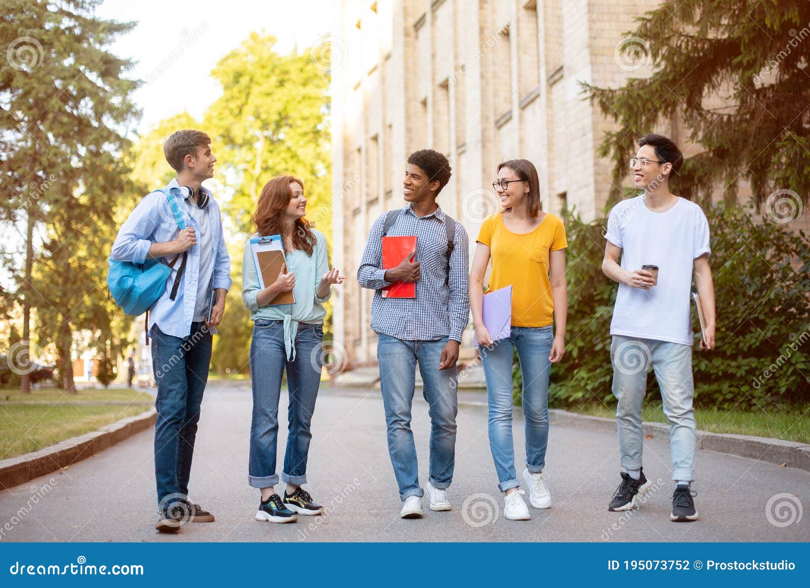 Group of Diverse Coursemates Talking about University Study Walking ...