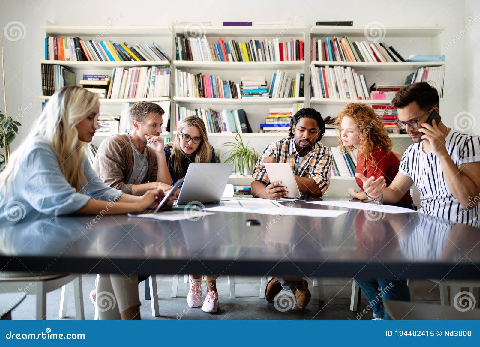 Group of Diverse Designers, Business People Brainstorming on Meeting in ... Group of Diverse Designers, Business People Brainstorming on Meeting in ...