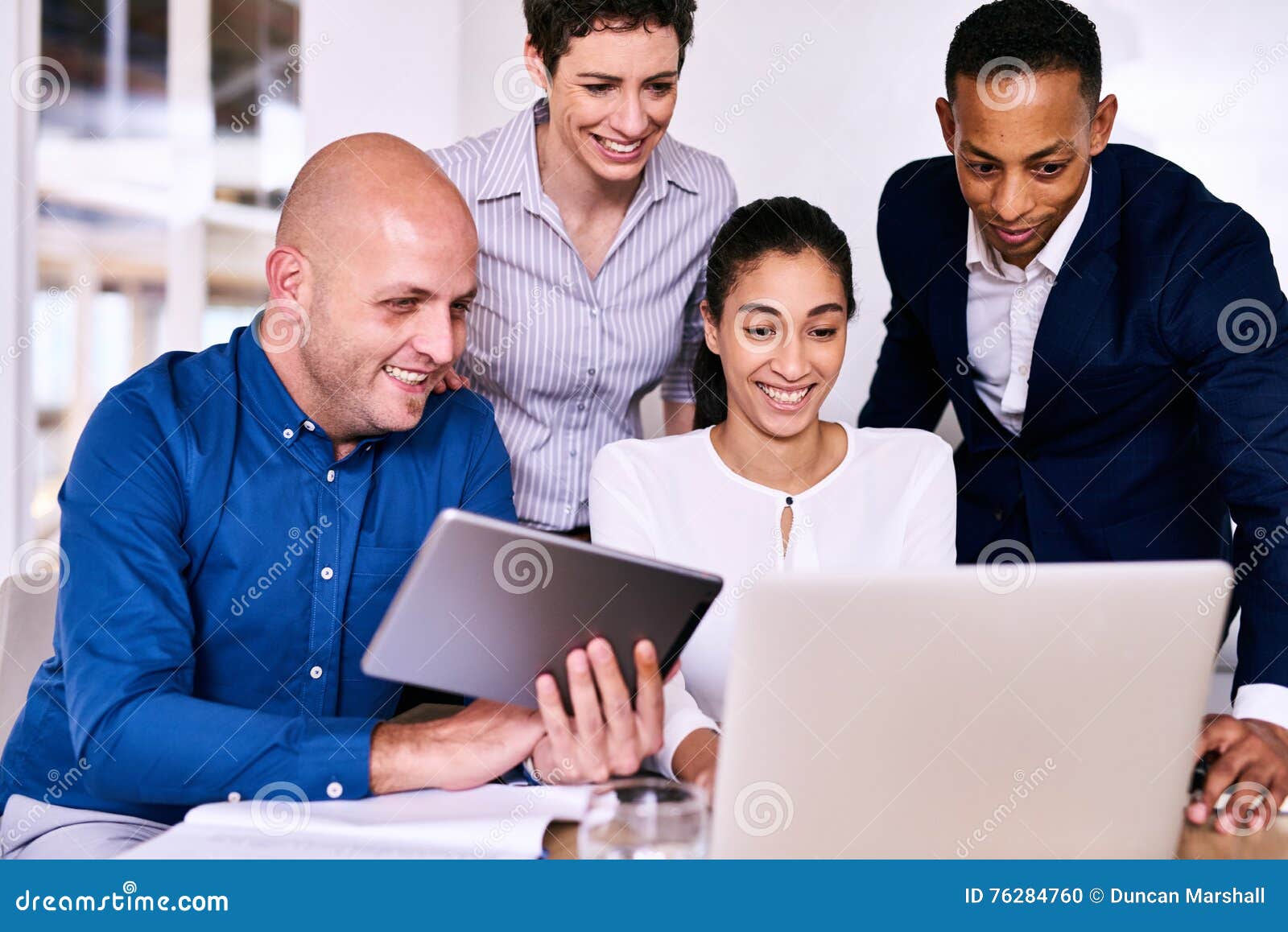 Group of Diverse Entrepreneurs Looking at a Computer and Tablet Stock ...