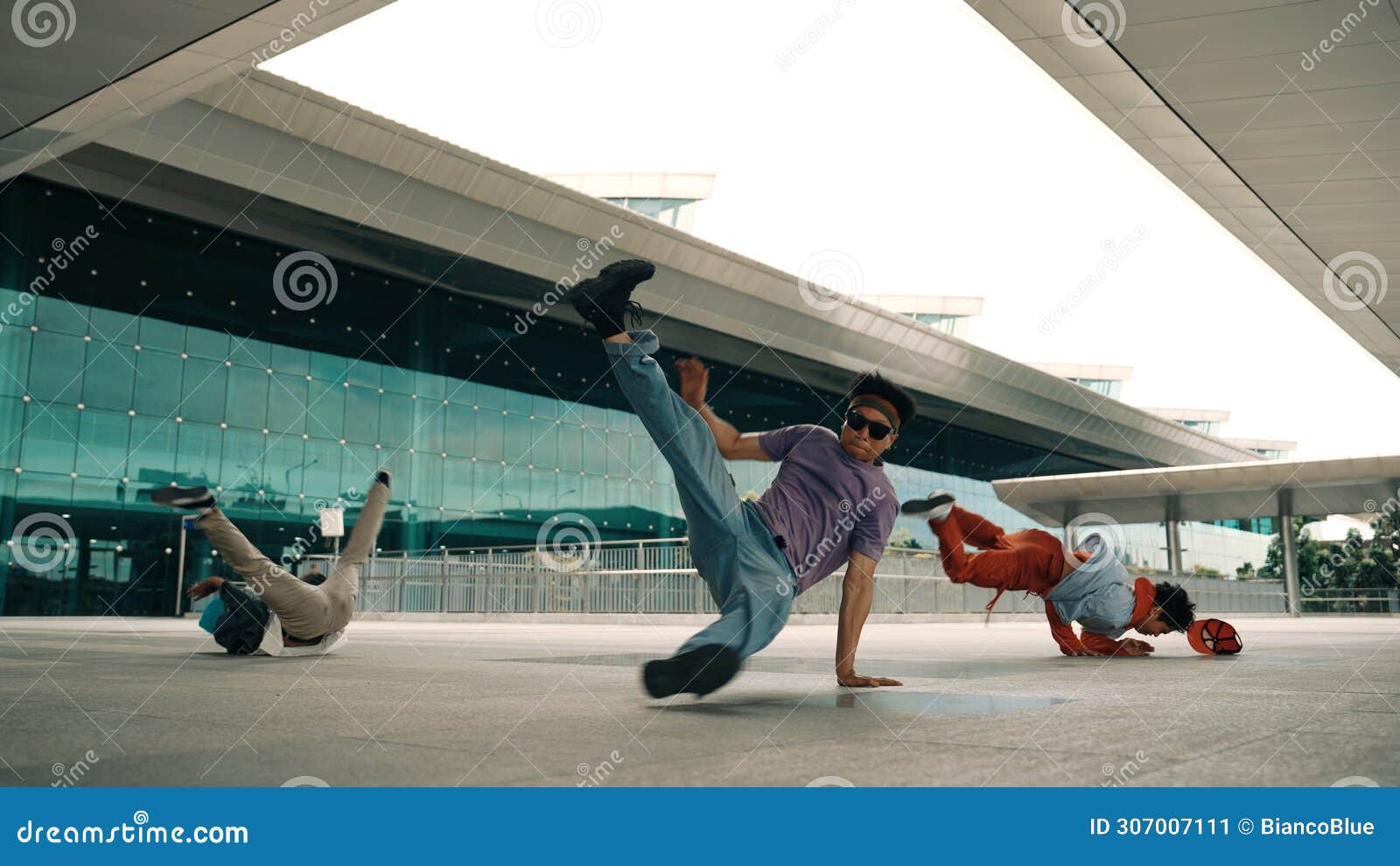 Group of Diverse Hipster or Dancer Doing Head Spin in Front of Mall ...