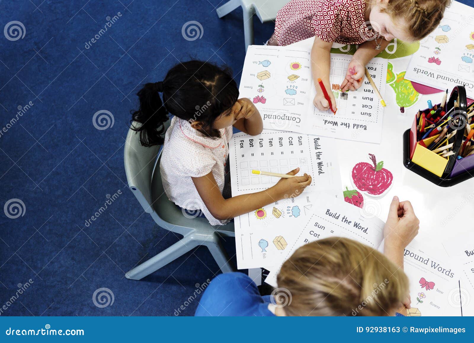 Group of Diverse Kids Coloring Workbook in Class Stock Image - Image of ...