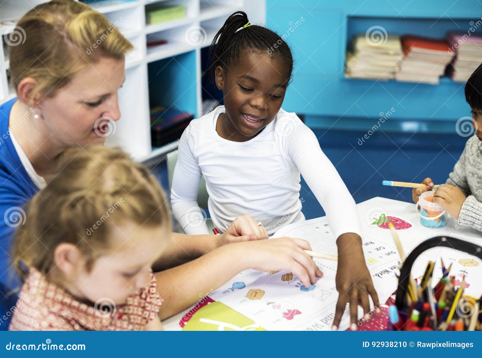 Group of Diverse Kids Coloring Workbook in Class Stock Photo - Image of ...