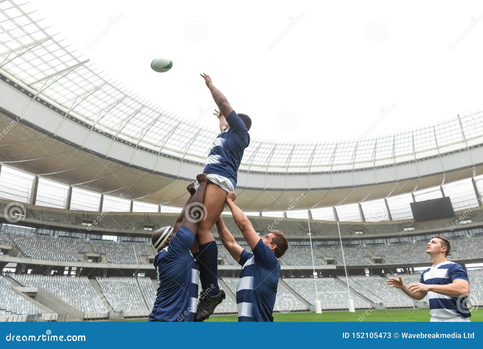 Group of Diverse Male Rugby Players Playing Rugby Match in Stadium ...