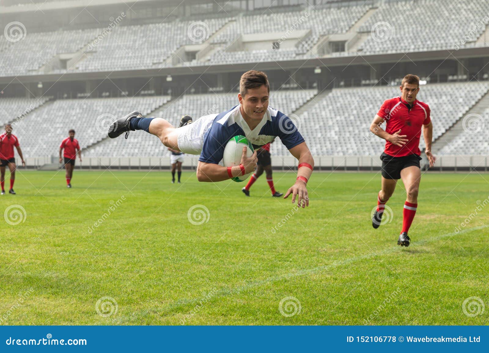 Group of Diverse Male Rugby Players Playing Rugby in Stadium Stock ...
