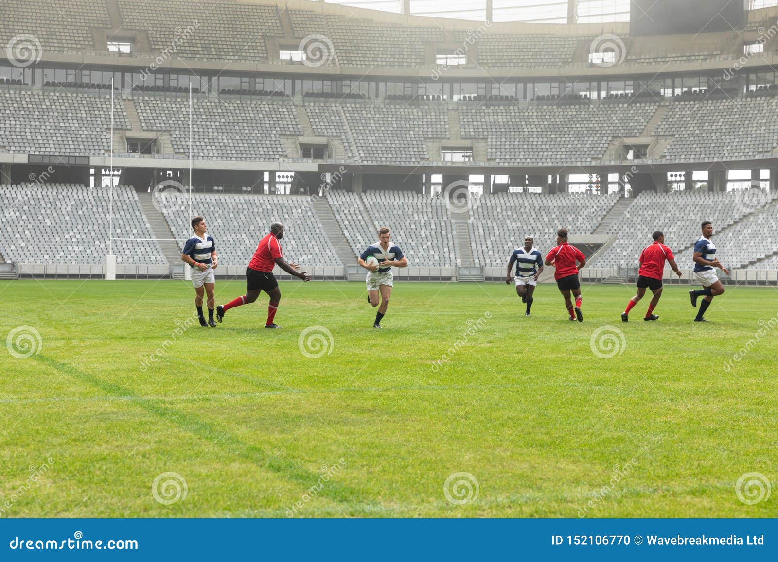 Group of Diverse Male Rugby Players Playing Rugby in Stadium Stock ...