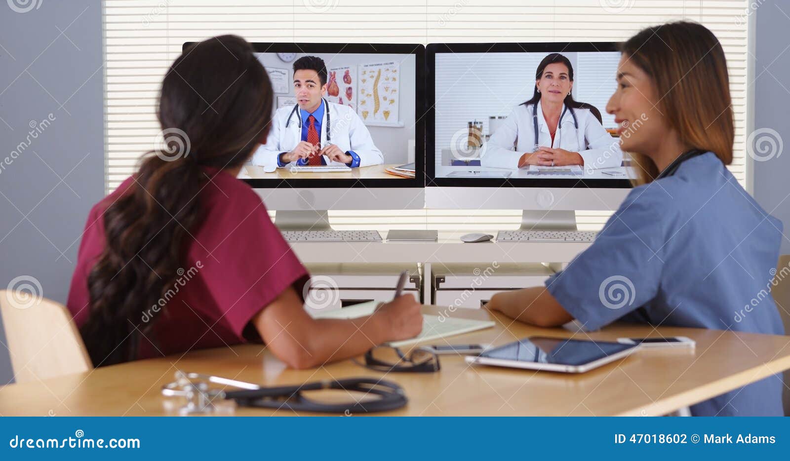 Group of Diverse Medical Doctors Video Conferencing Stock Photo - Image ...
