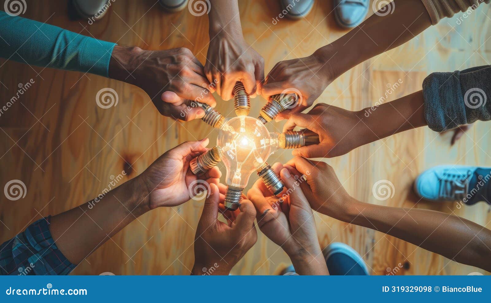 A Group of Diverse People Holding a Light Bulb in Their Hands ...