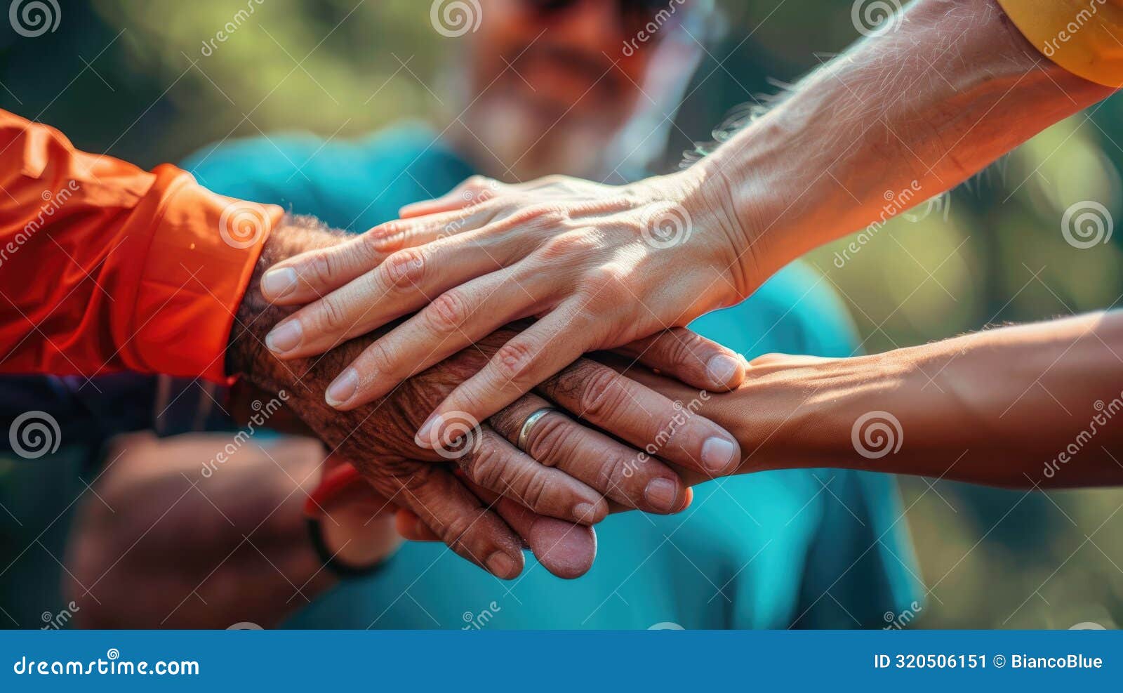 A Group of Diverse People Joining Their Hands Together To Show Unity ...