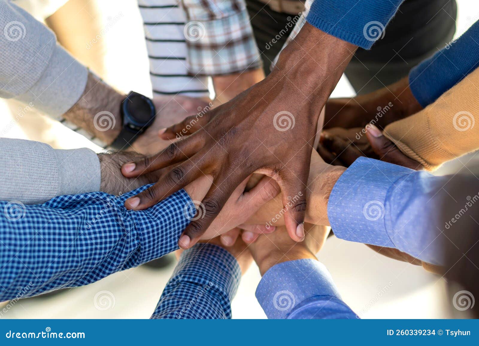 Group of Diverse People Stacking Hands in the Middle. Stock Photo ...