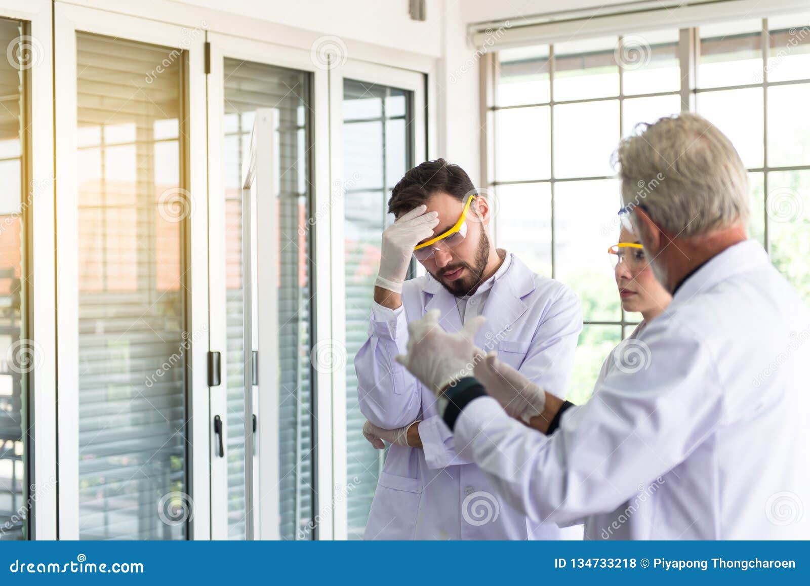 Group of Diverse Scientist Explaining Research Information Together in ...
