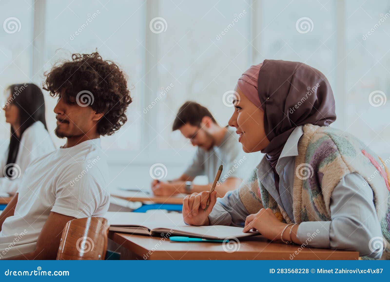 A Group of Diverse Students Engages in Lively Discussion As they ...