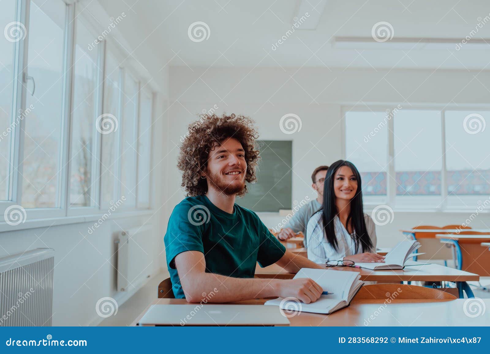 A Group of Diverse Students Engages in Lively Discussion As they ...