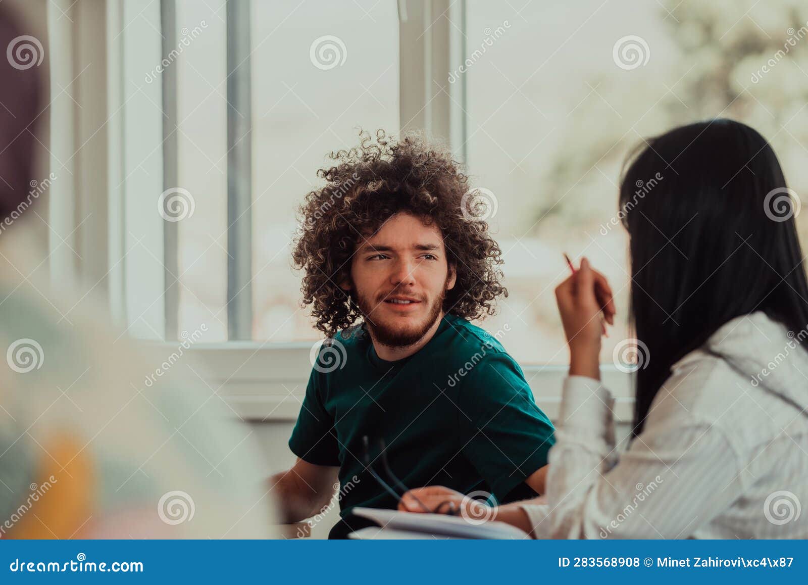 A Group of Diverse Students Engages in Lively Discussion As they ...