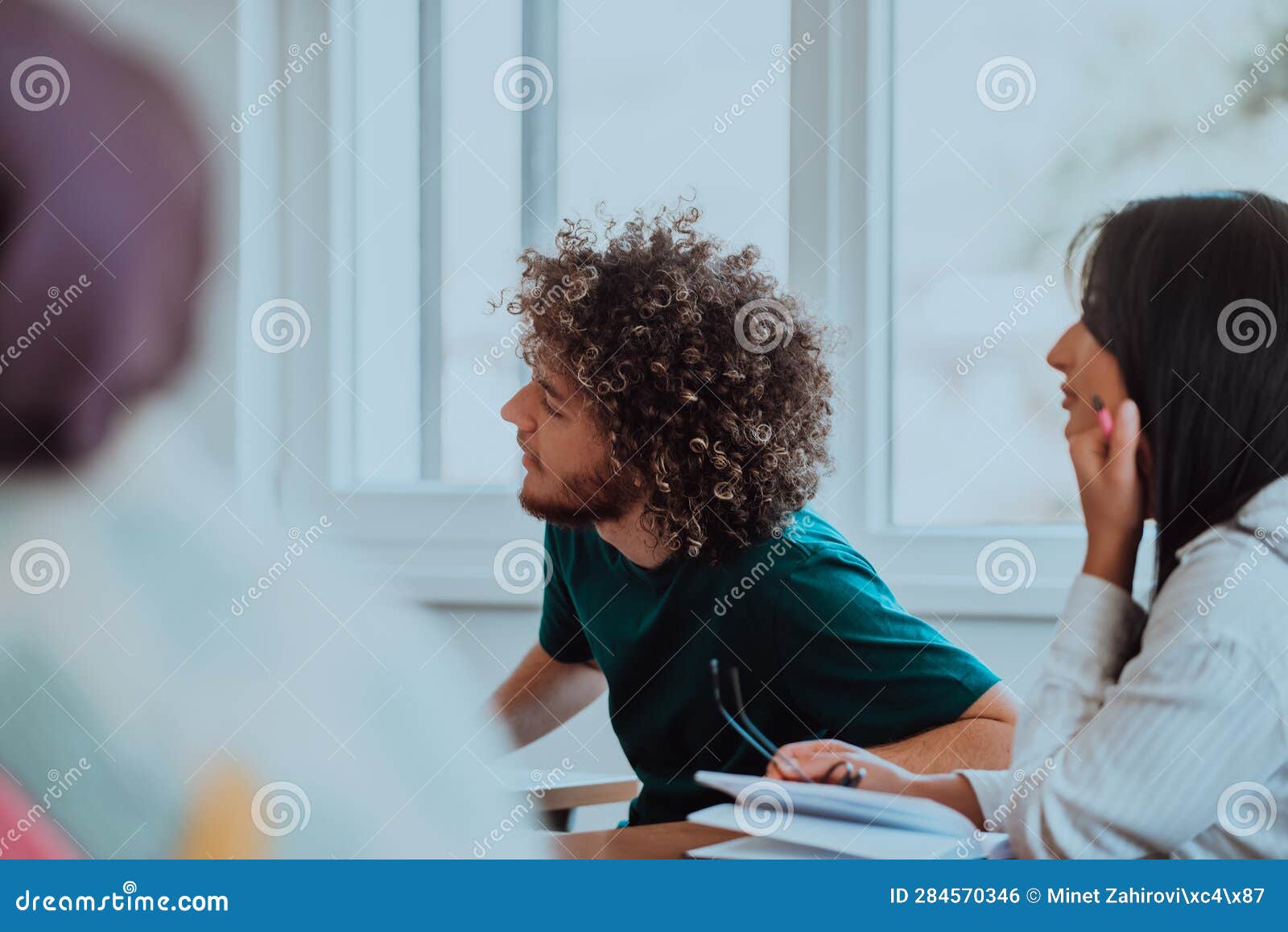 A Group of Diverse Students Engages in Lively Discussion As they ...